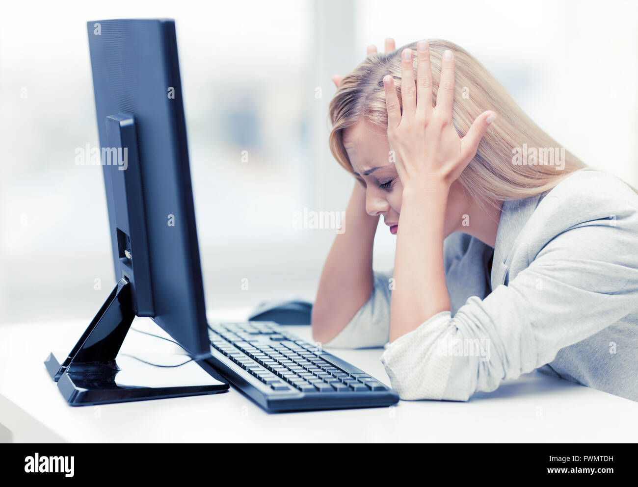 stressed woman with computer Stock Photo - Alamy