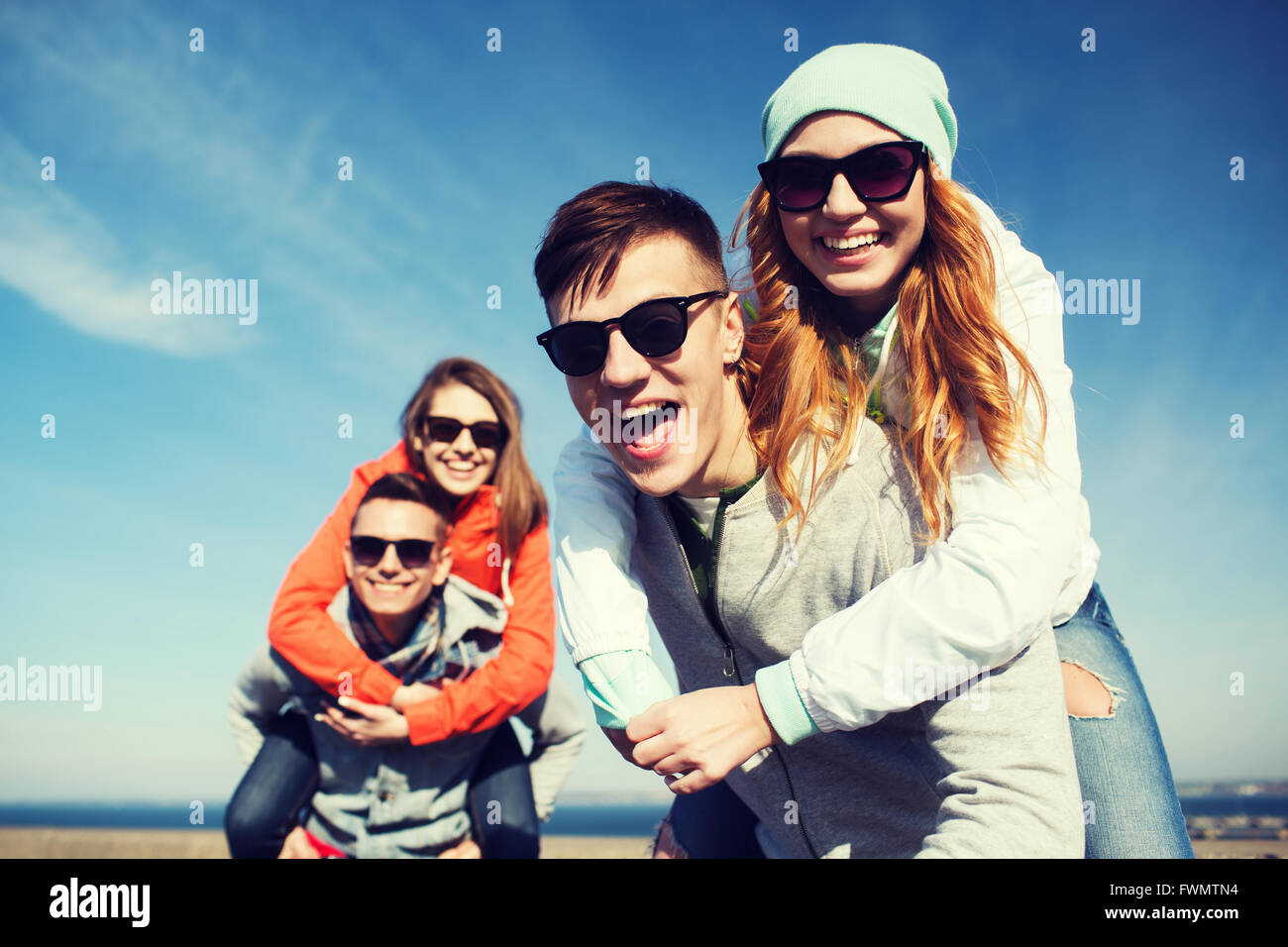 happy teenage friends having fun outdoors Stock Photo - Alamy
