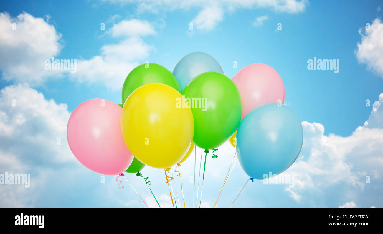 bunch of inflated helium balloons over blue sky Stock Photo - Alamy