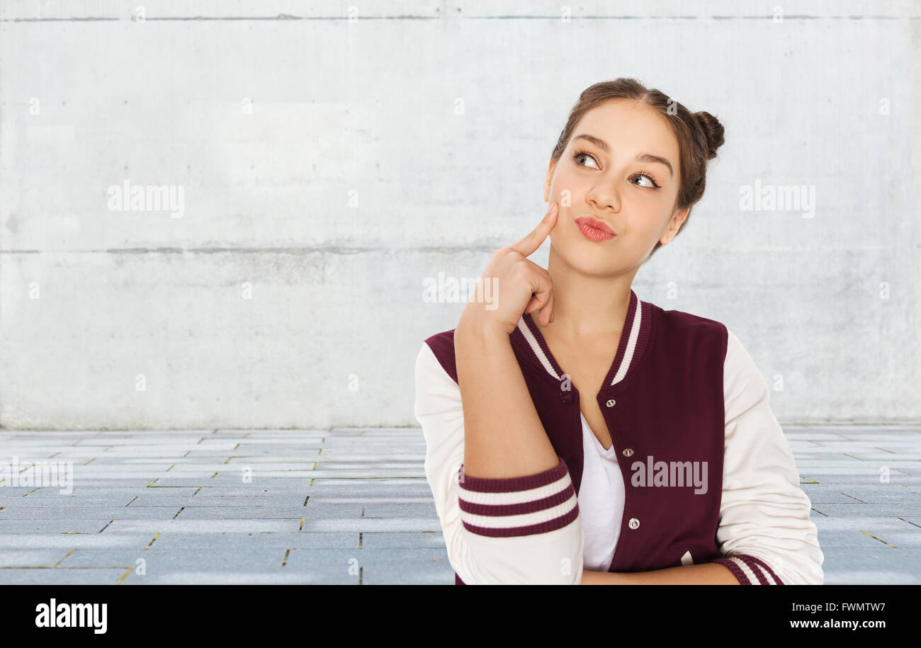 happy pretty teenage girl thinking Stock Photo - Alamy