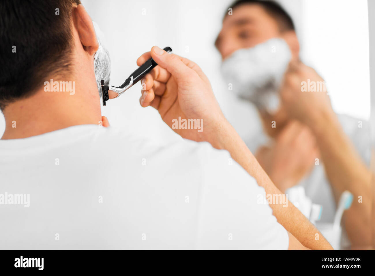 close up of man shaving beard with razor blade Stock Photo - Alamy
