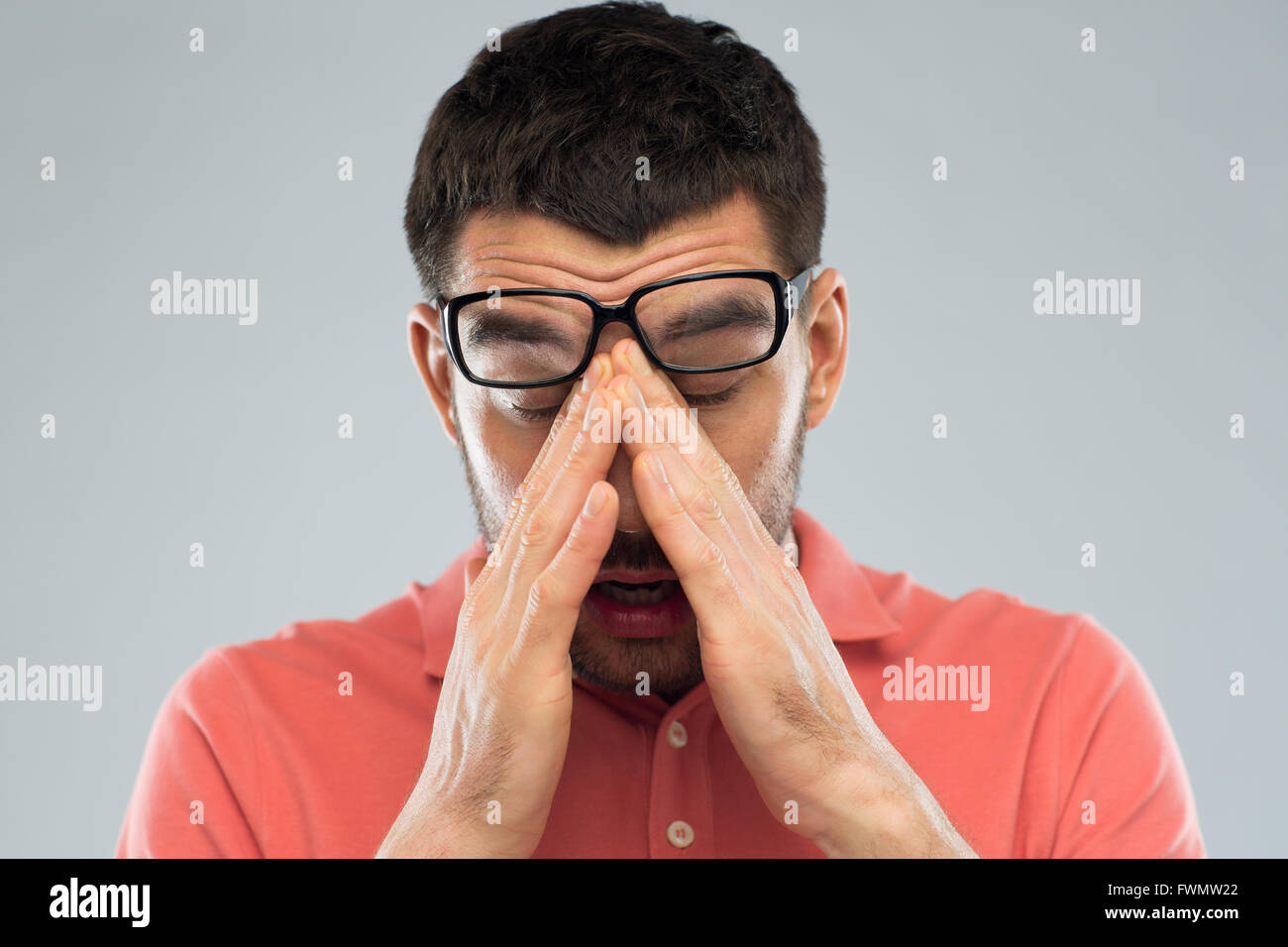 Stressed man rubbing face eyes hi-res stock photography and images - Alamy