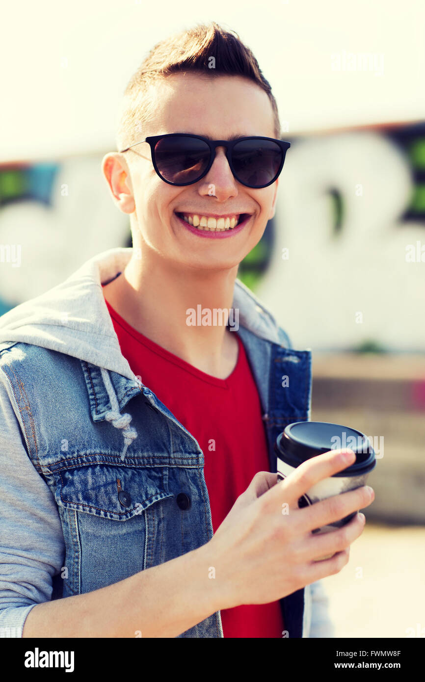 smiling young man or boy drinking coffee Stock Photo - Alamy