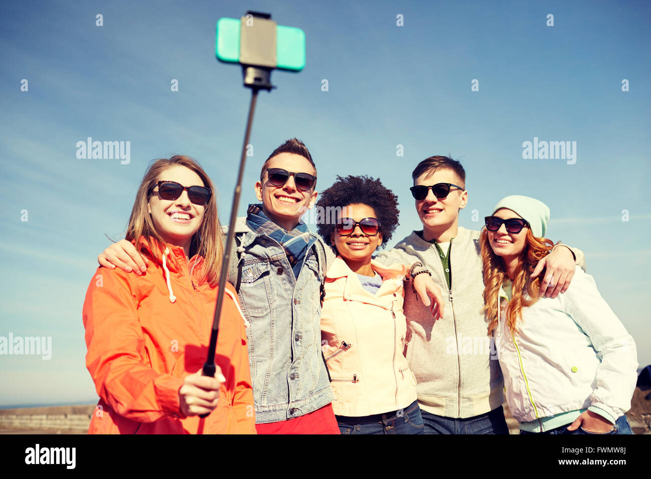 smiling friends taking selfie with smartphone Stock Photo - Alamy