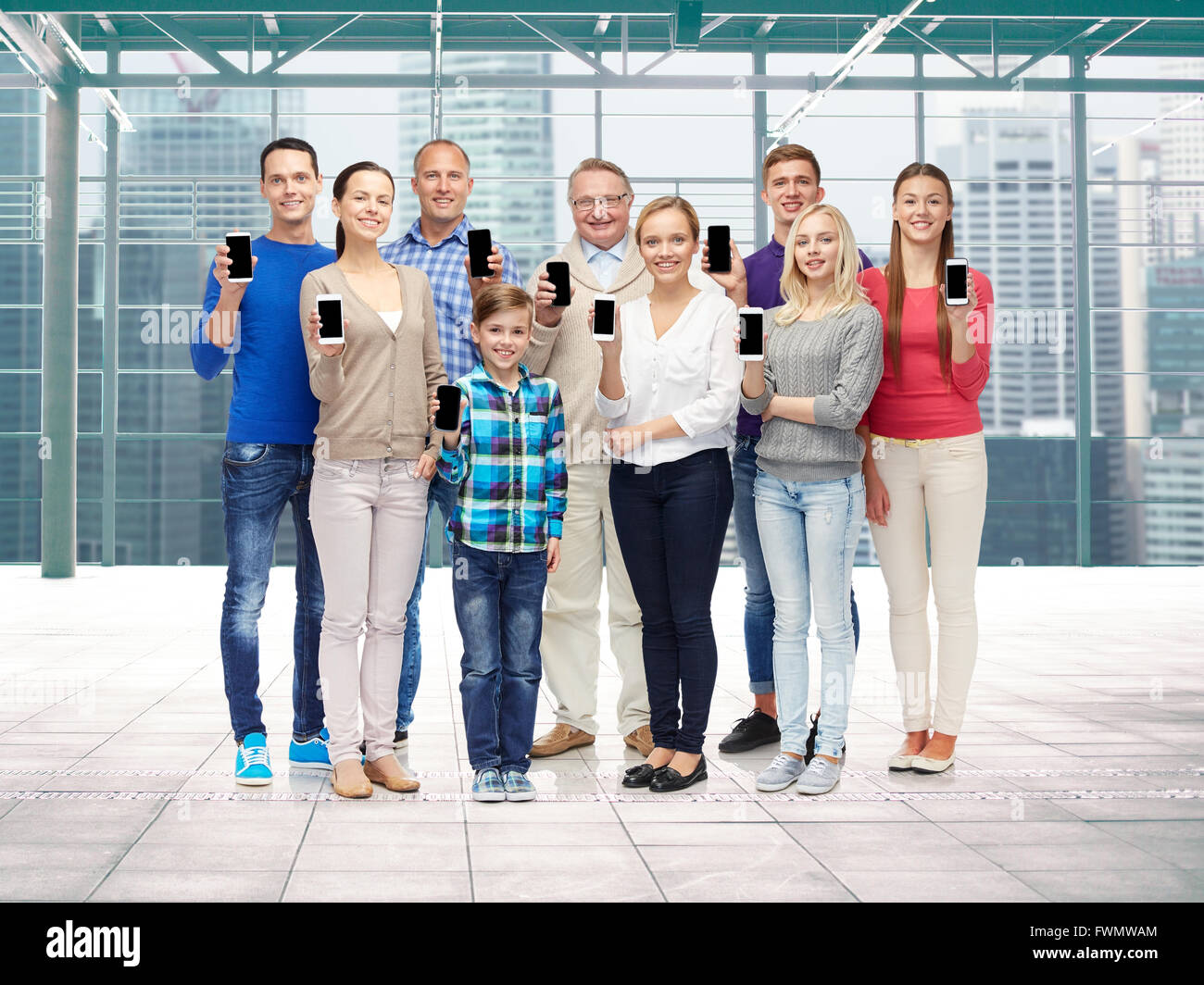 group of smiling people with smartphones Stock Photo - Alamy