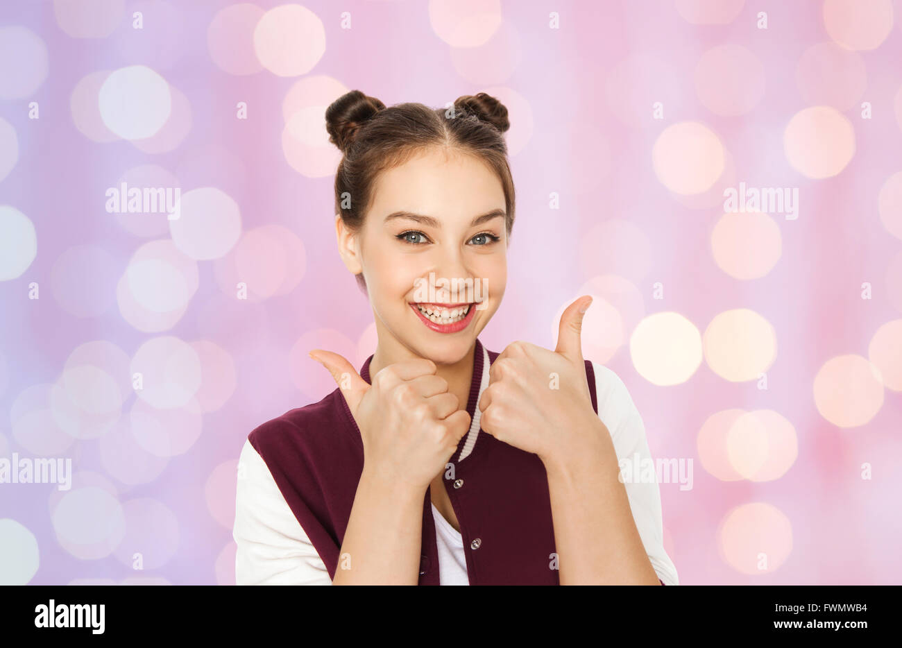 happy pretty teenage girl showing thumbs up Stock Photo - Alamy