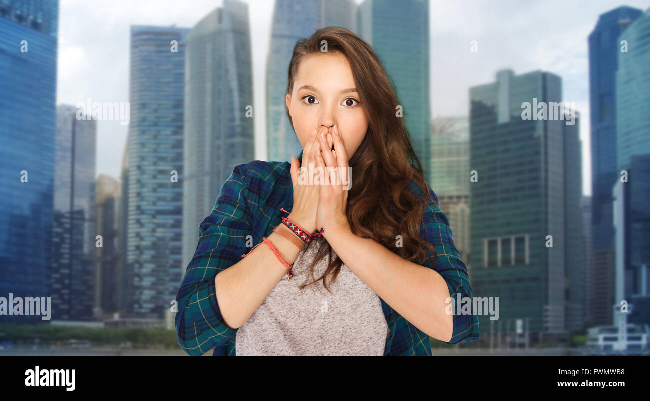 scared teenage girl over singapore city background Stock Photo - Alamy