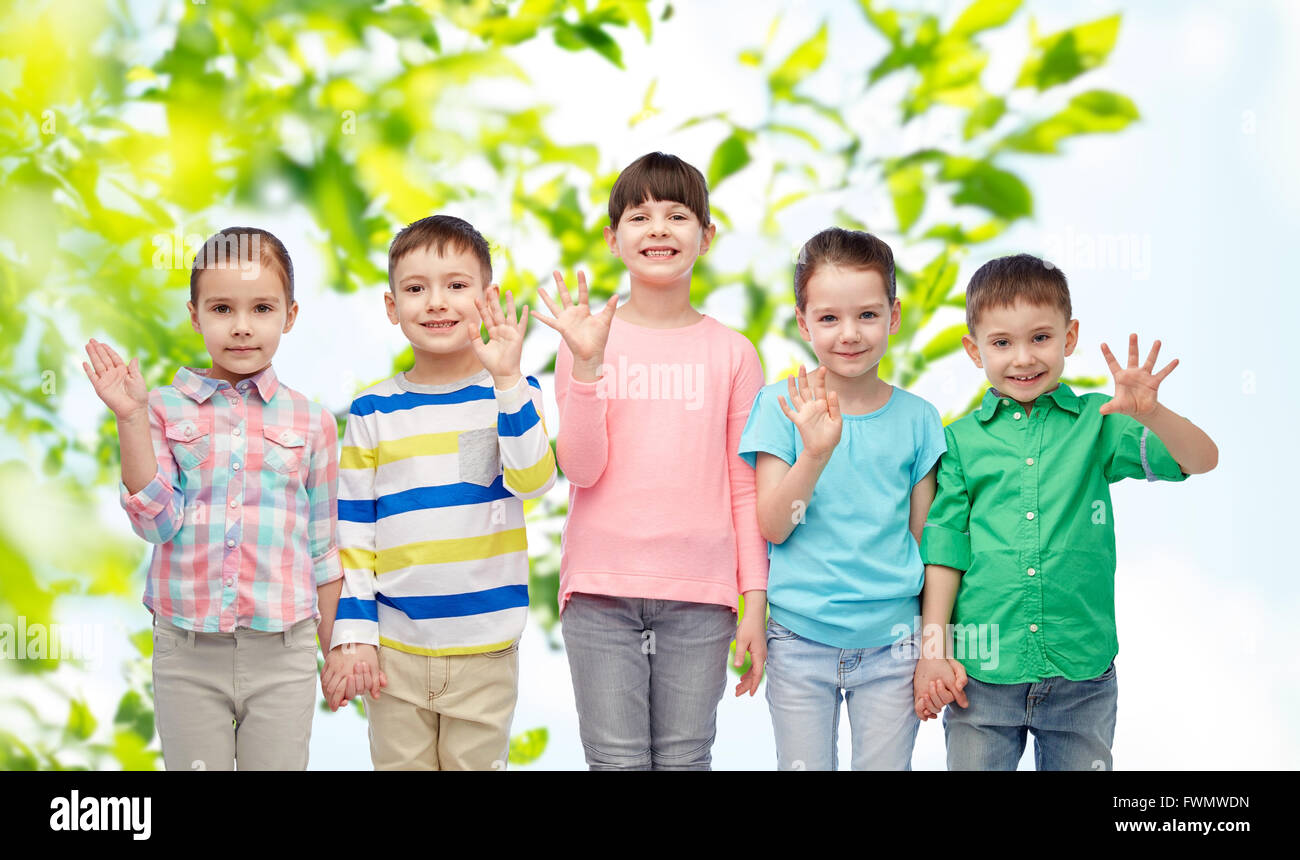 happy smiling little children holding hands Stock Photo - Alamy