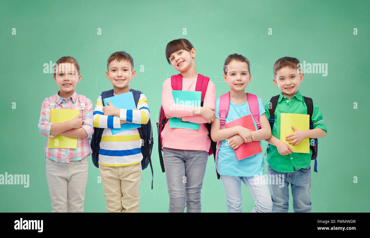 happy children with school bags and notebooks Stock Photo - Alamy