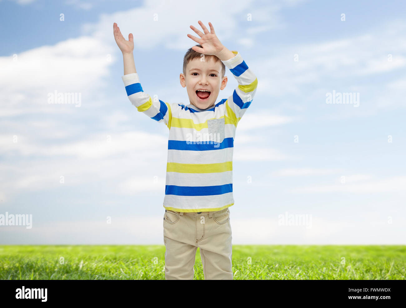 happy little boy waving hands Stock Photo - Alamy