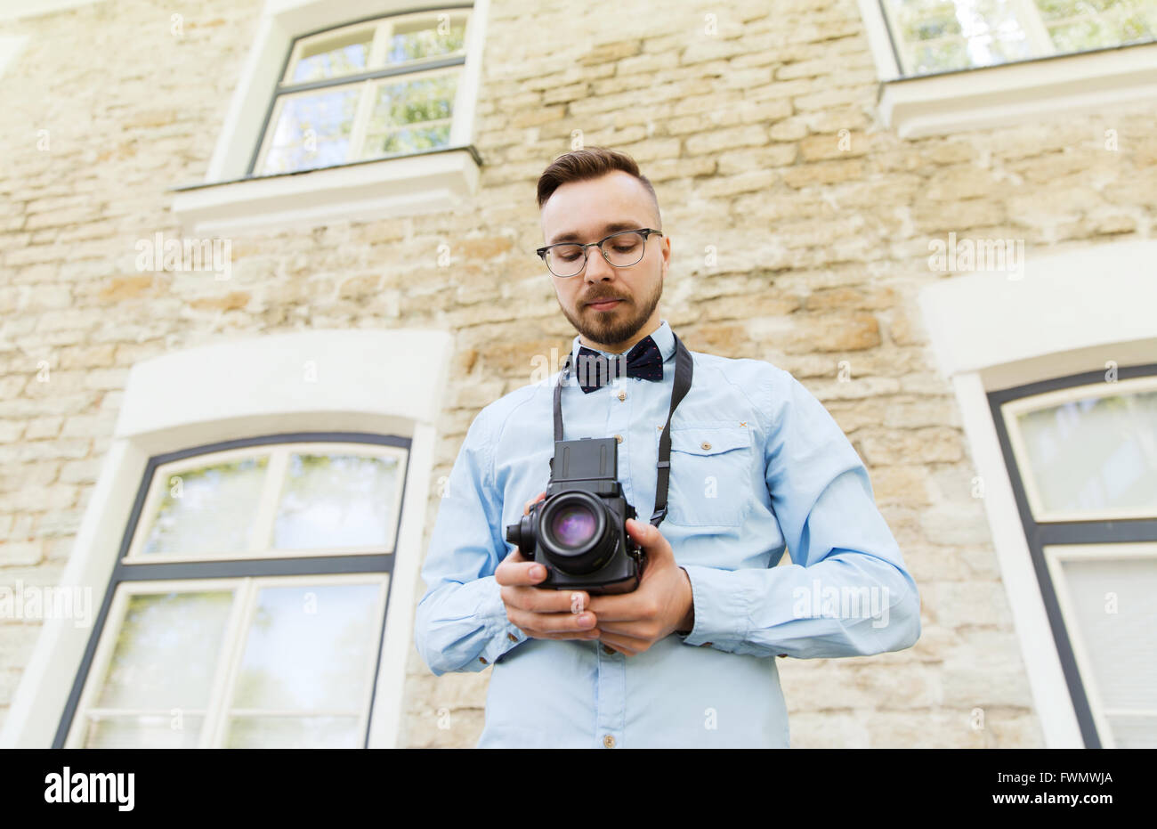 Man holding film camera hi-res stock photography and images - Alamy