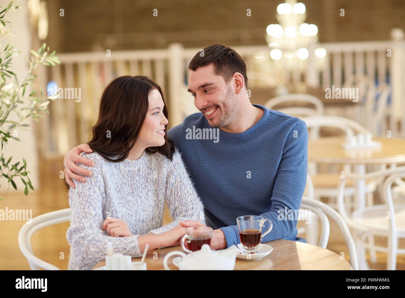 happy couple drinking tea at restaurant Stock Photo - Alamy