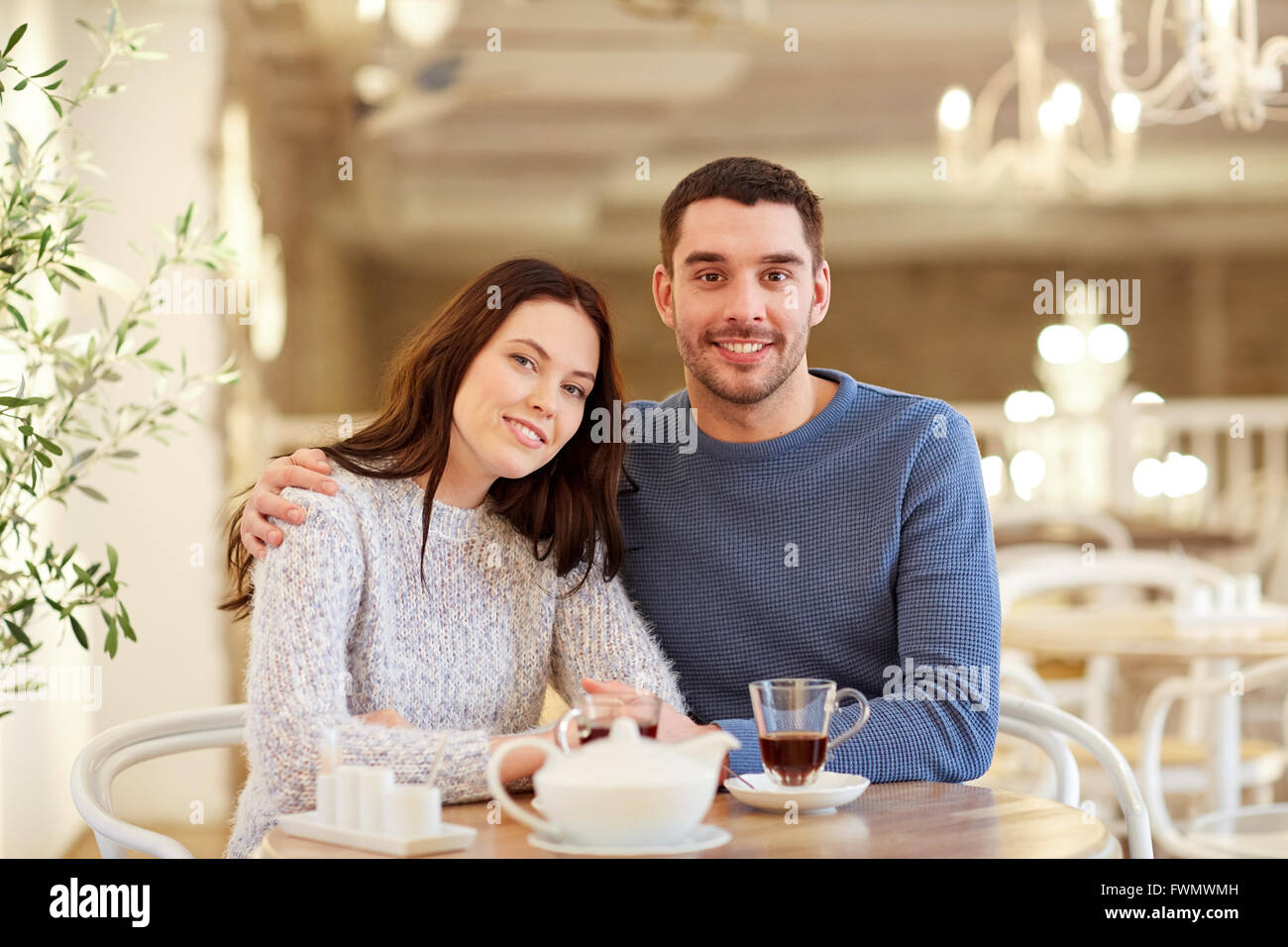 happy couple drinking tea at restaurant Stock Photo - Alamy