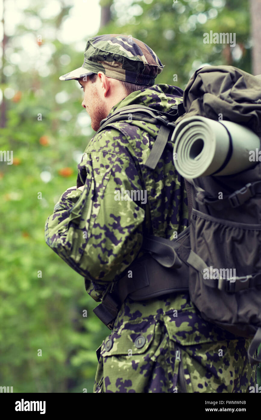 young soldier with backpack in forest Stock Photo - Alamy