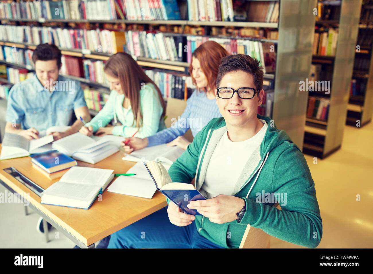 students with books preparing to exam in library Stock Photo - Alamy