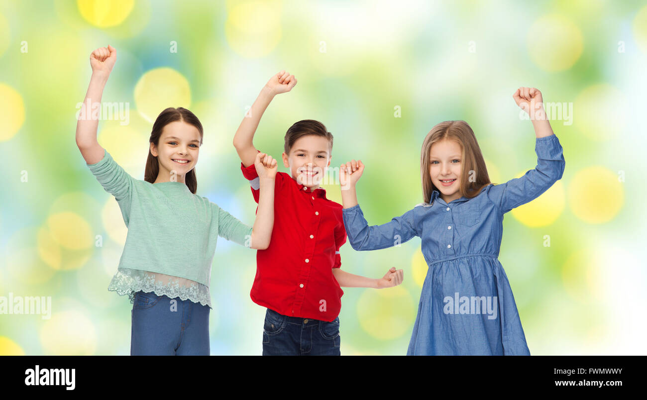happy boy and girls celebrating victory Stock Photo - Alamy