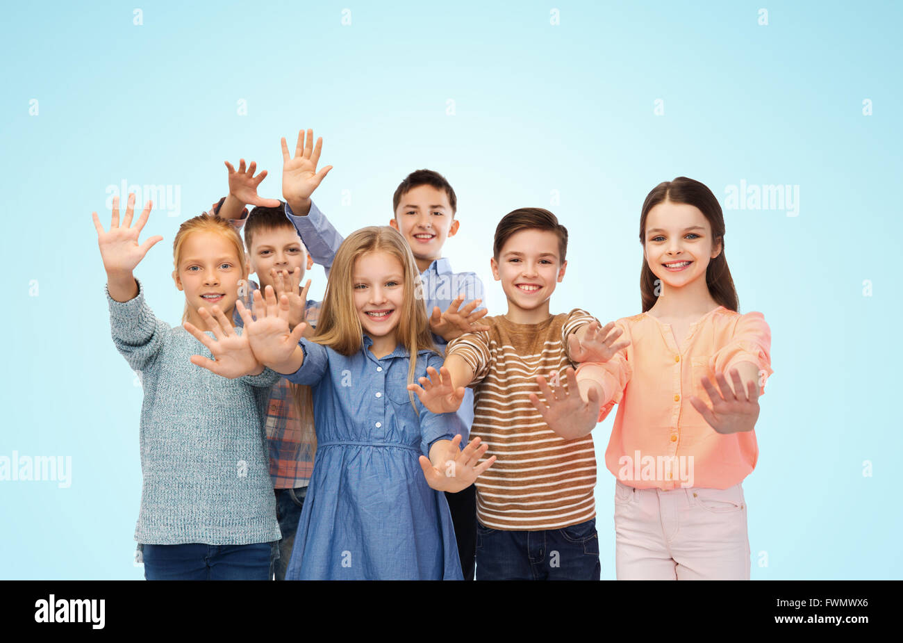 happy children waving hands Stock Photo - Alamy
