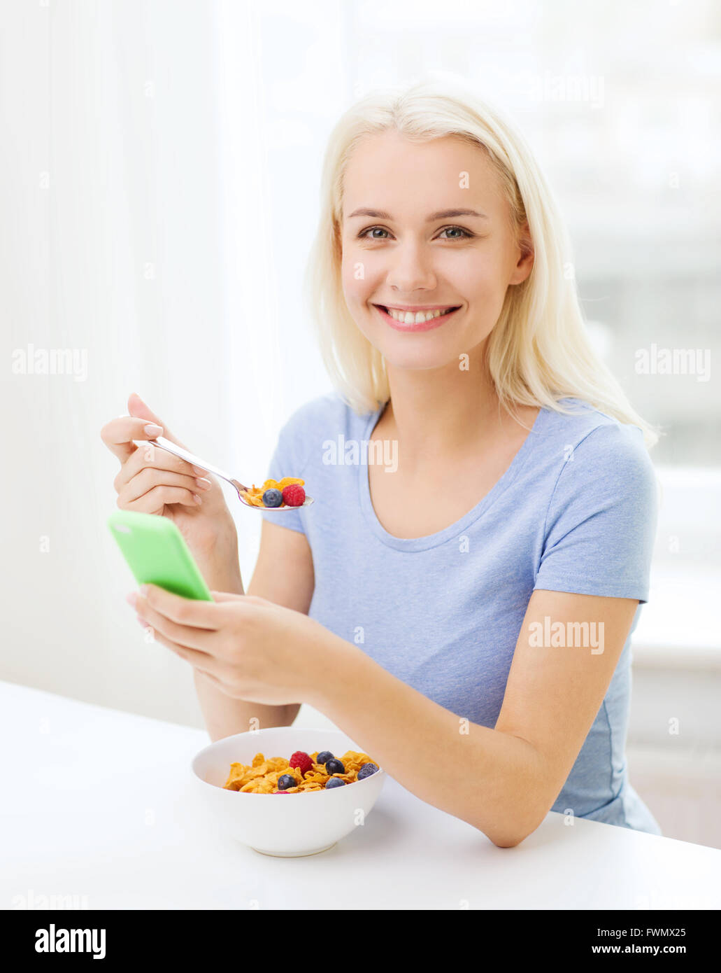 Woman eating organic porridge hi-res stock photography and images - Alamy