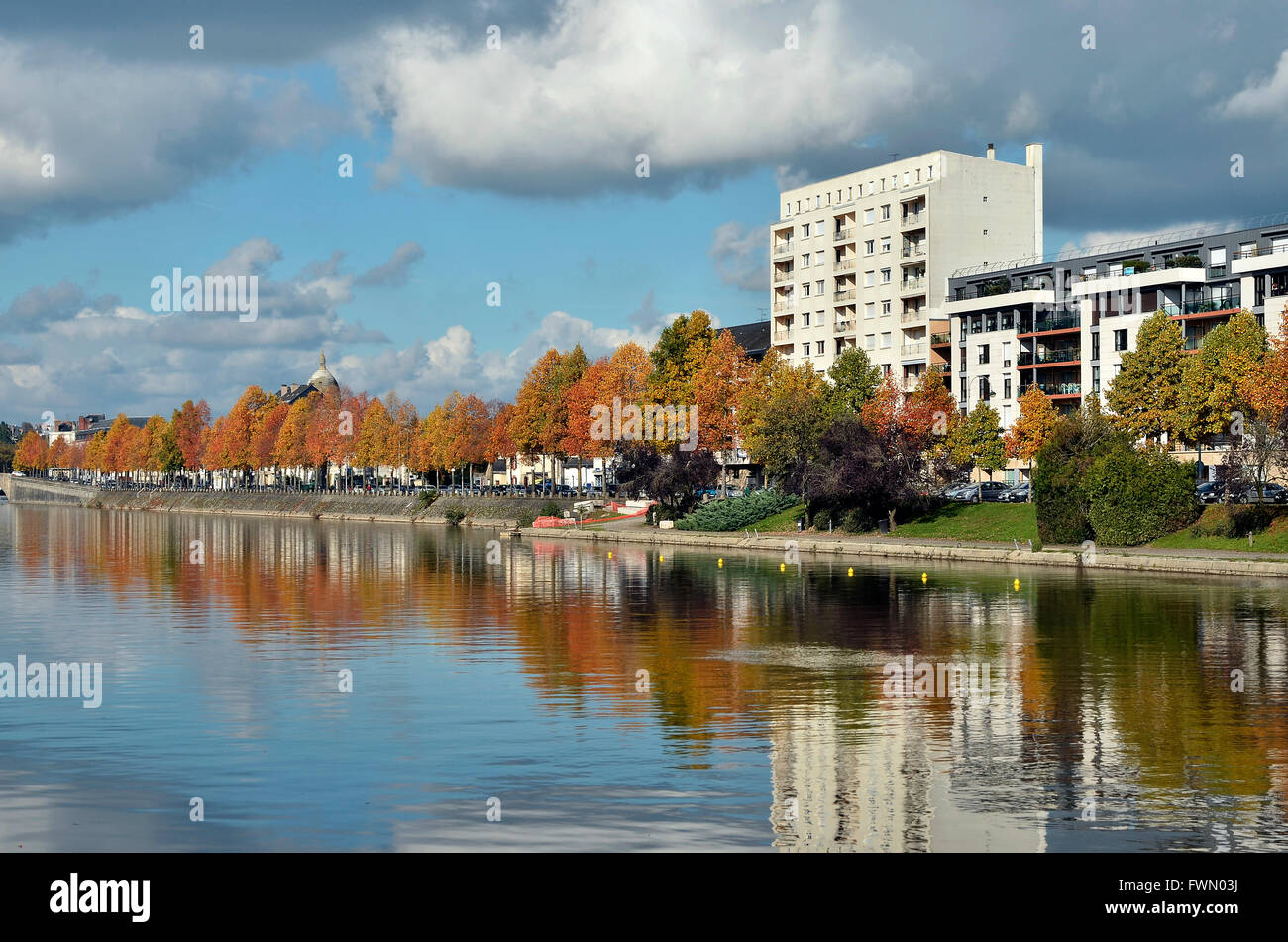 The river Mayenne at Laval with fall foliage trees, commune in the ...