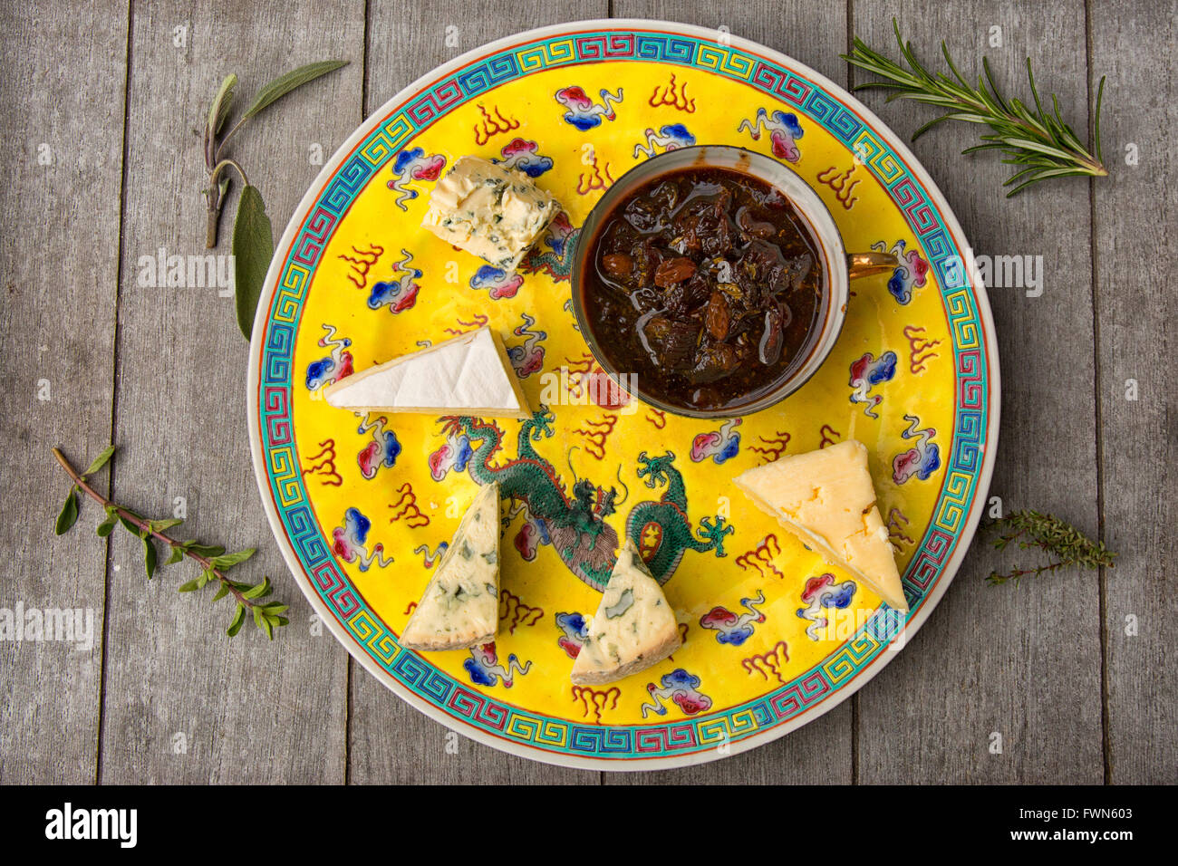 Plate with assortment of cheeses and home made herbal chutney Stock ...
