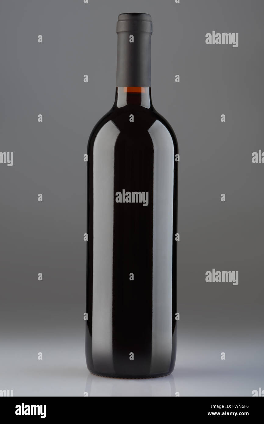 Red wine bottle on gray background, clipping path Stock Photo - Alamy