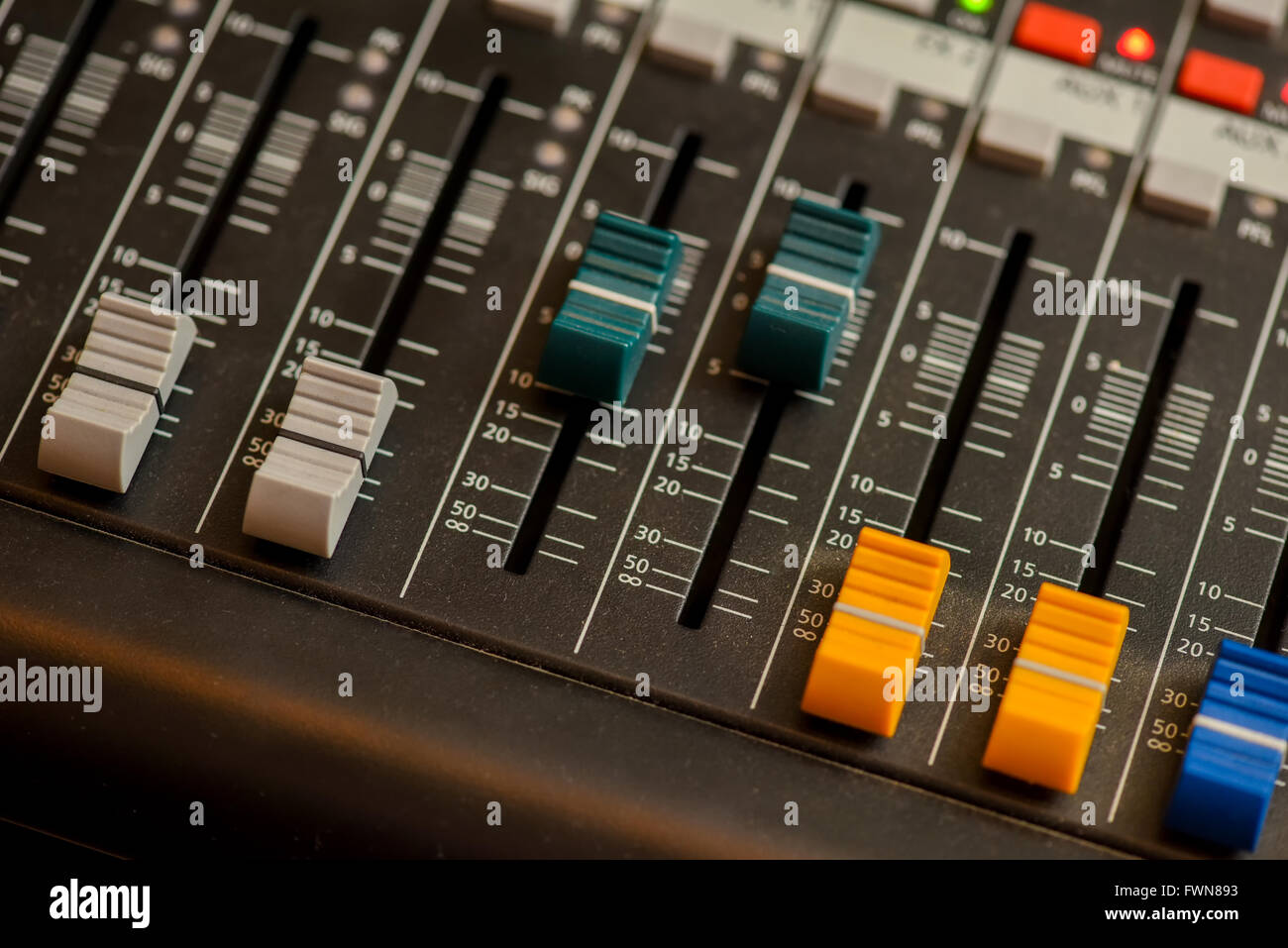 Colored sound mixer bottom with side light Stock Photo - Alamy