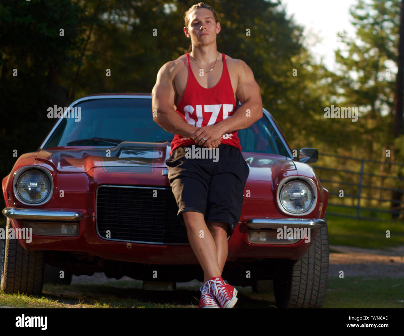 Bodybuilder with Camaro Stock Photo - Alamy