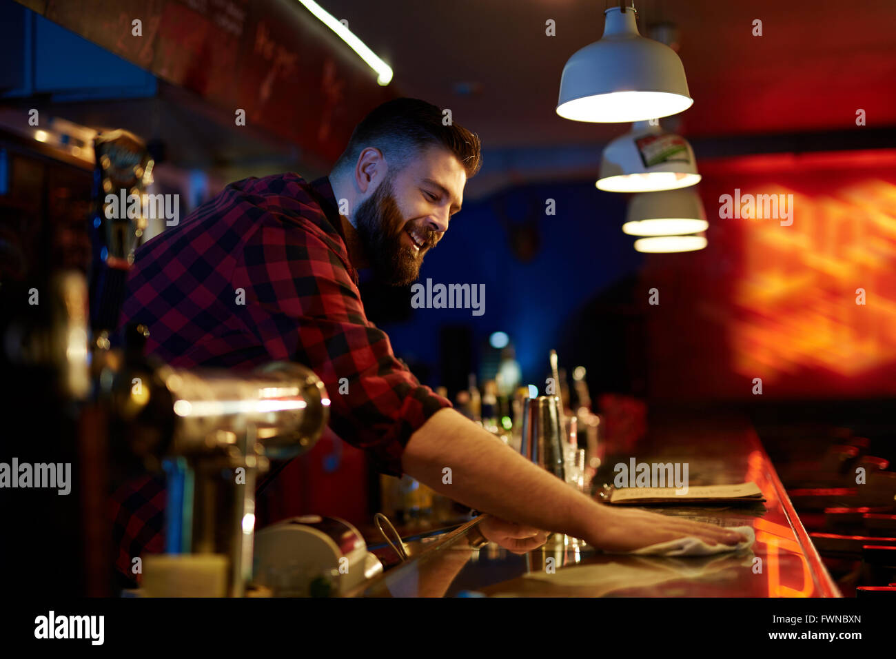 Wiping bar counter Stock Photo - Alamy