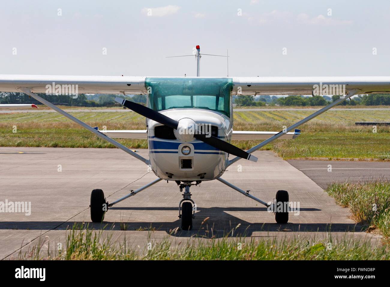 Light aircraft parked at an airfield Stock Photo - Alamy