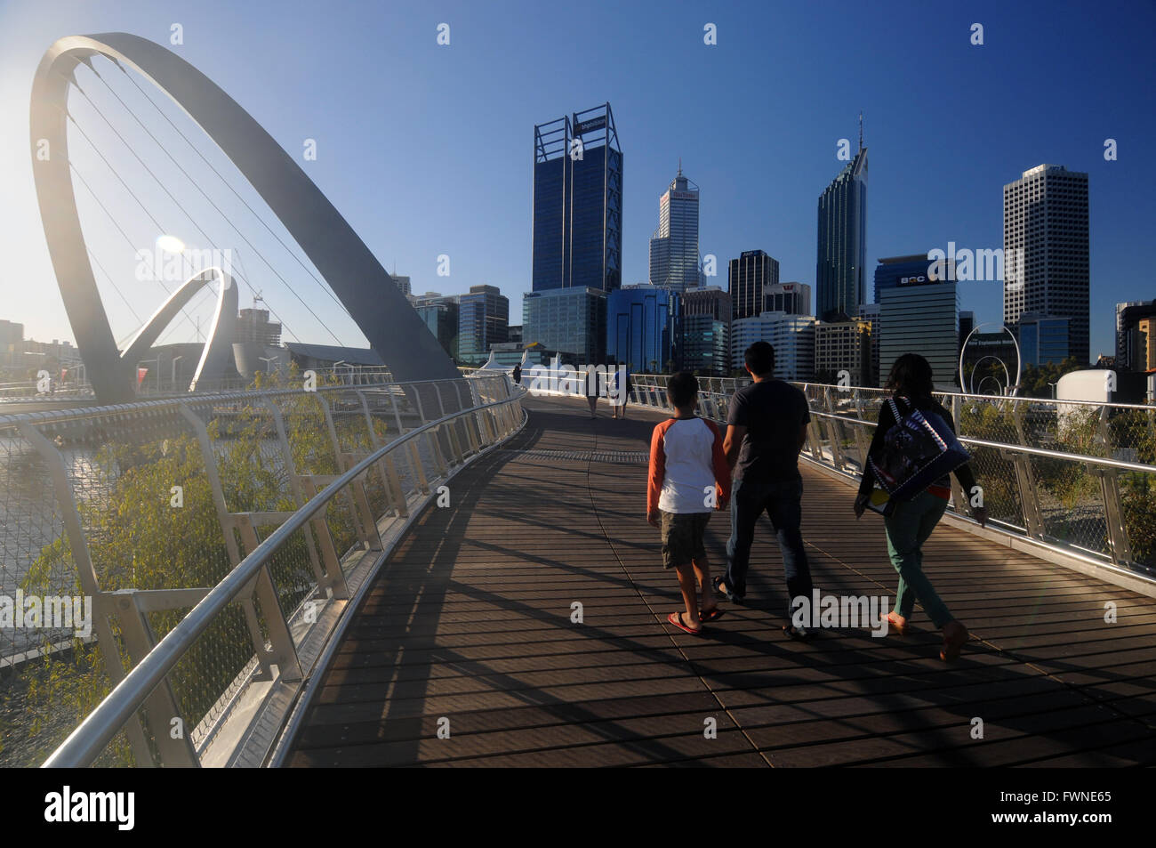 People walking across Elizabeth Quay Bridge towards city, Perth ...