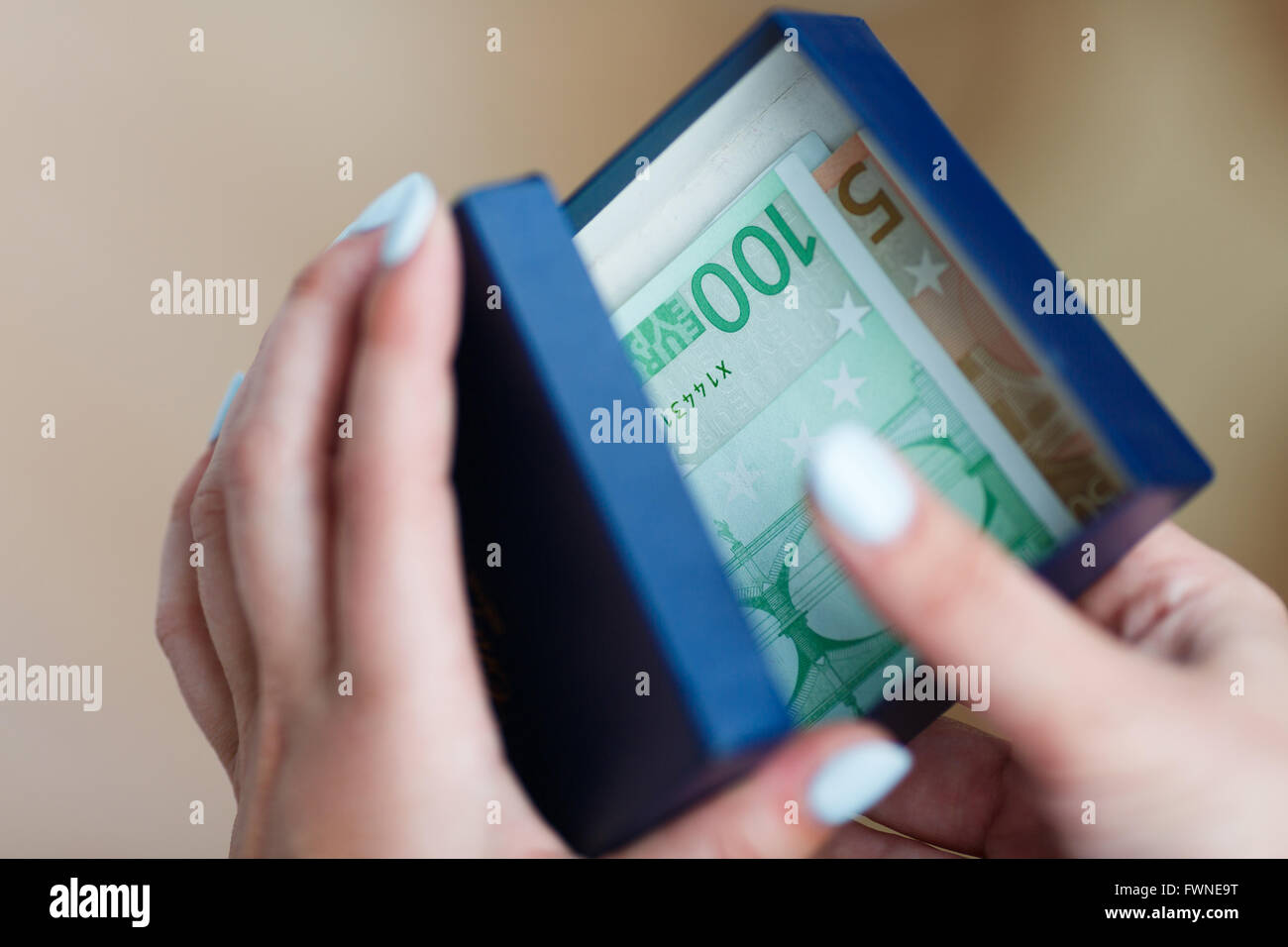 Woman hands open box with euro banknotes inside Stock Photo - Alamy