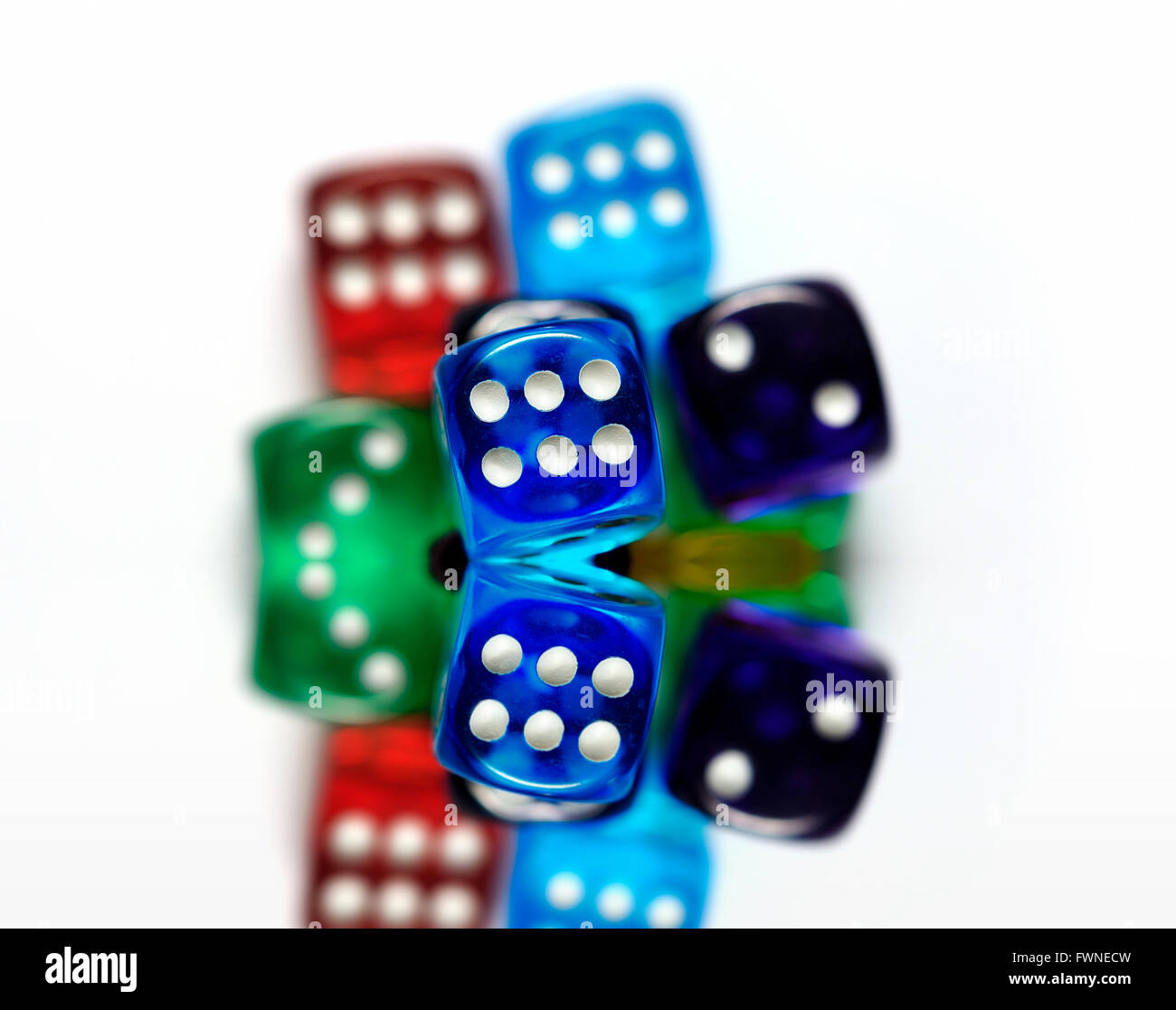 Assorted colored dice digitally reflected Stock Photo - Alamy
