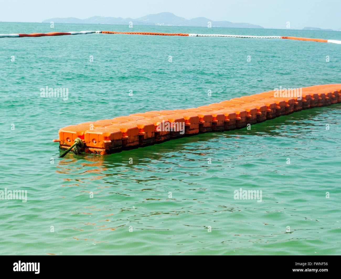 vertical buoy barrier on sea surface to protect people from any boat ...