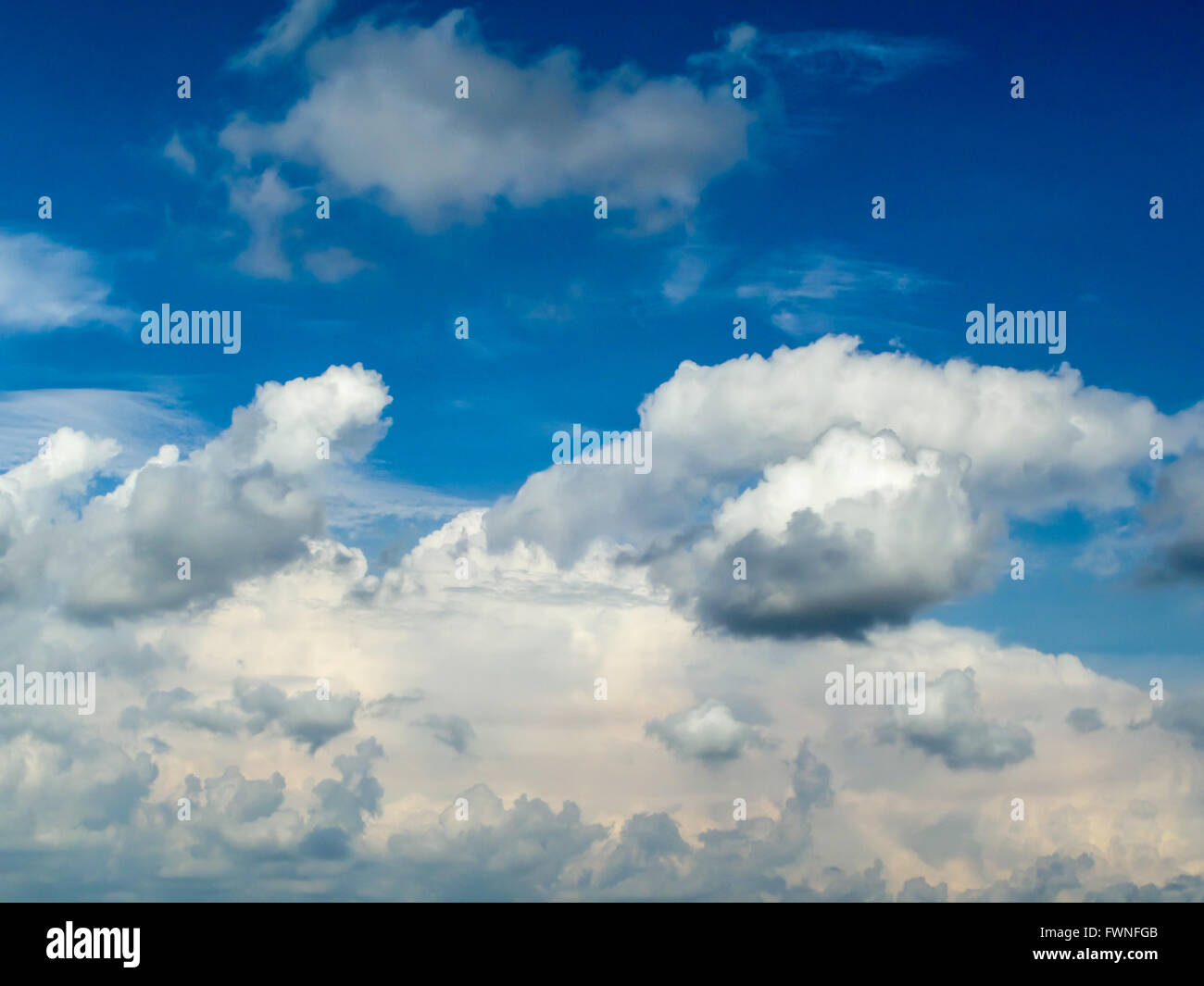 Blue sky and heap white cloud moving and sun shine Stock Photo - Alamy