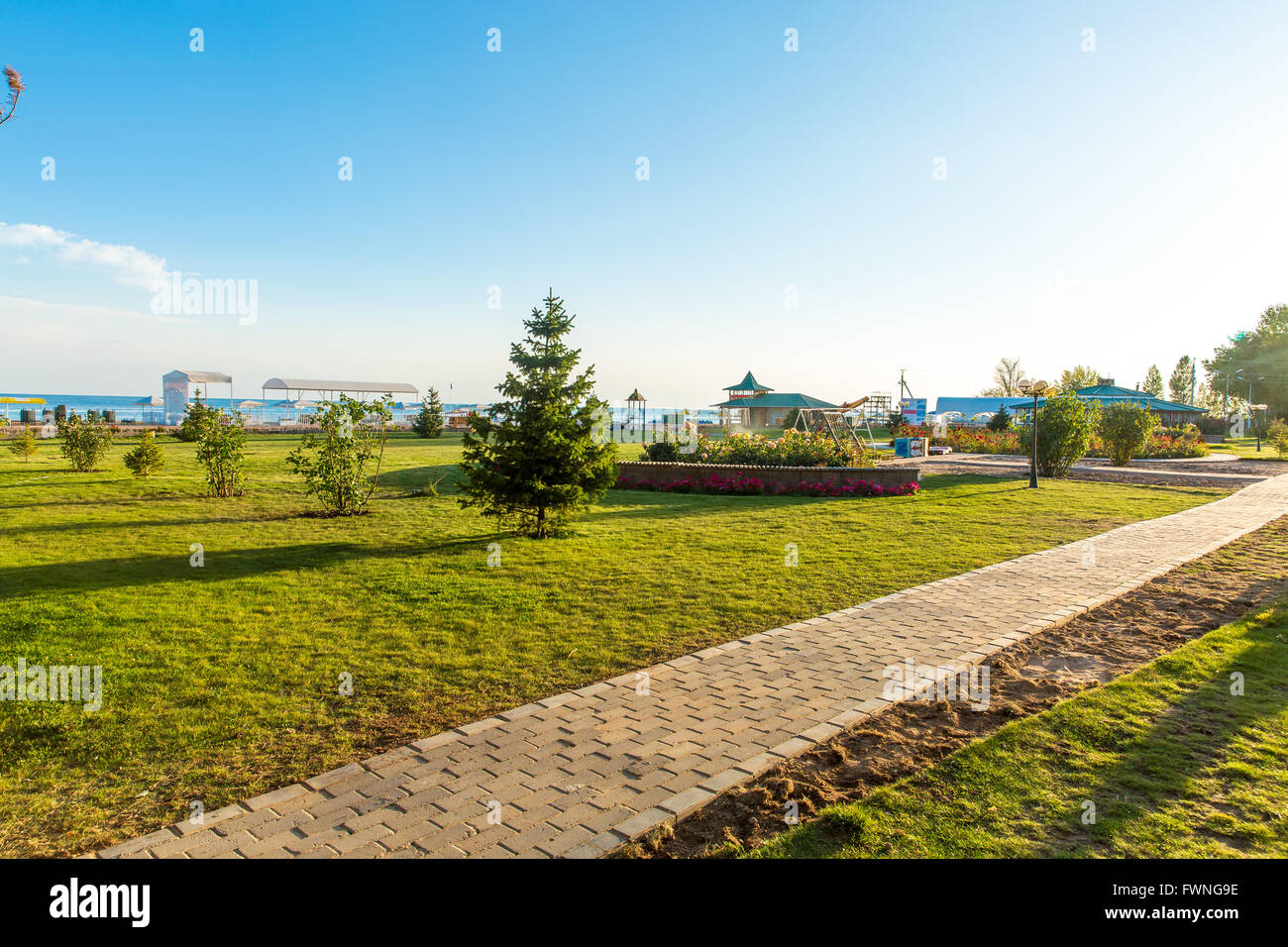 View on beach at the sea and pier Stock Photo - Alamy