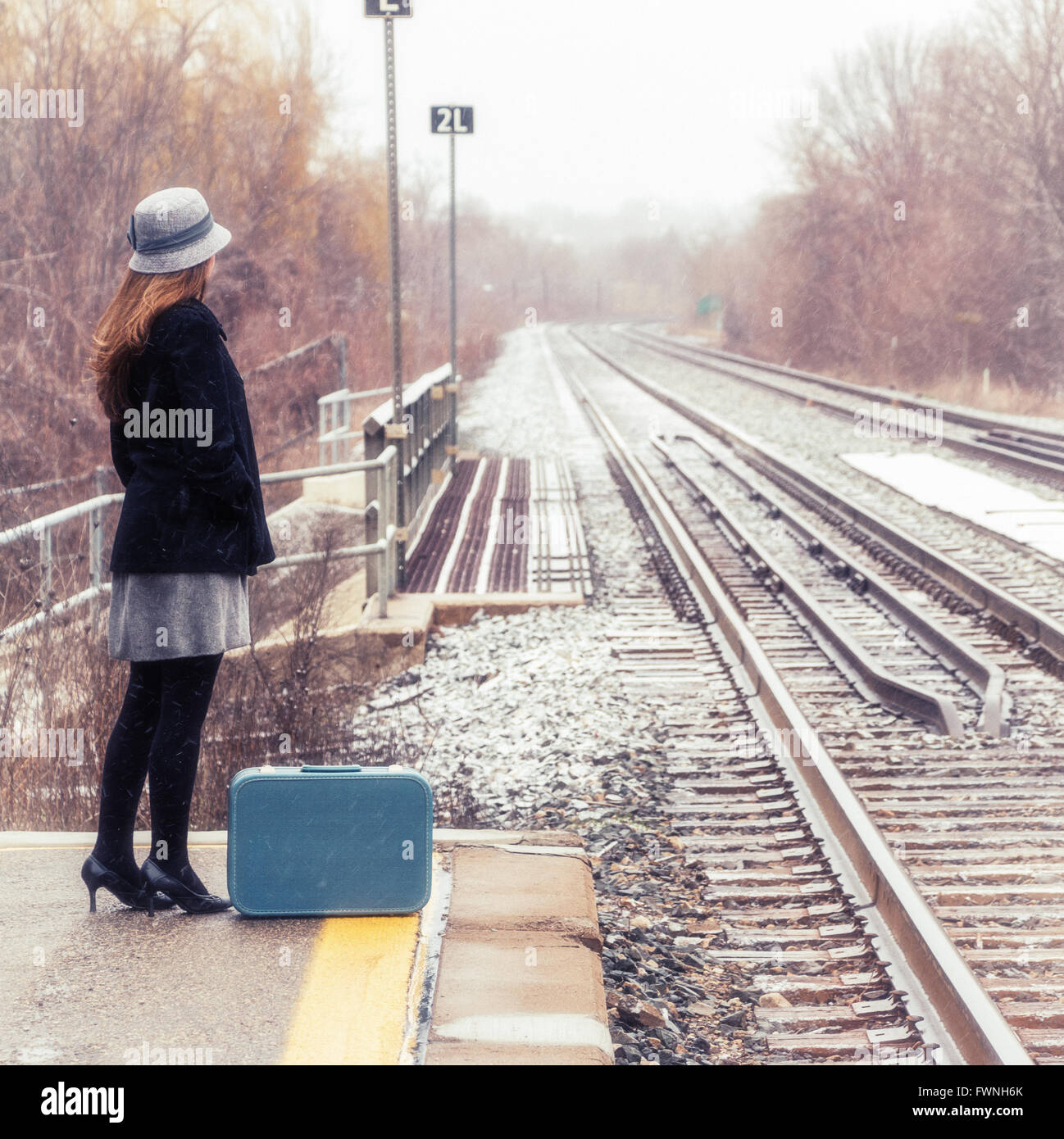 Woman train platform snow hi-res stock photography and images - Alamy