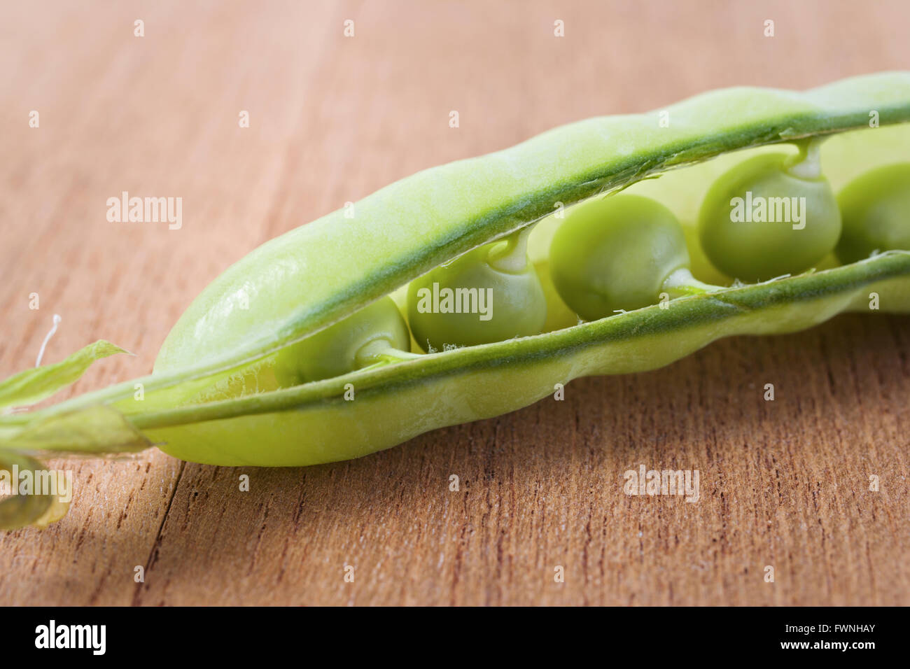 Opened pea pod Stock Photo - Alamy