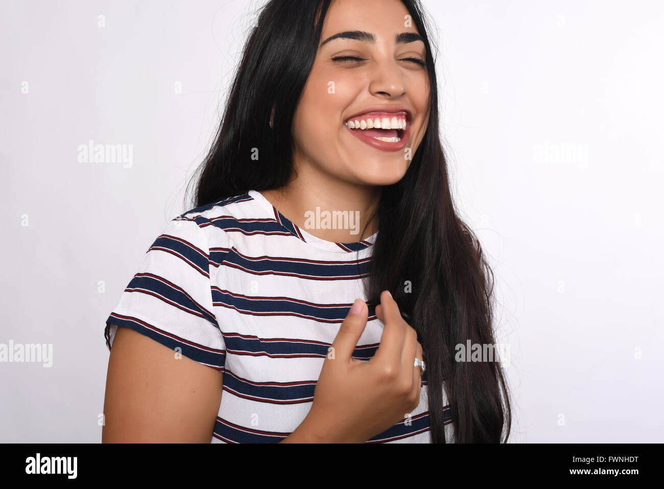Portrait of attractive young woman similing in a studio. Isolated white ...
