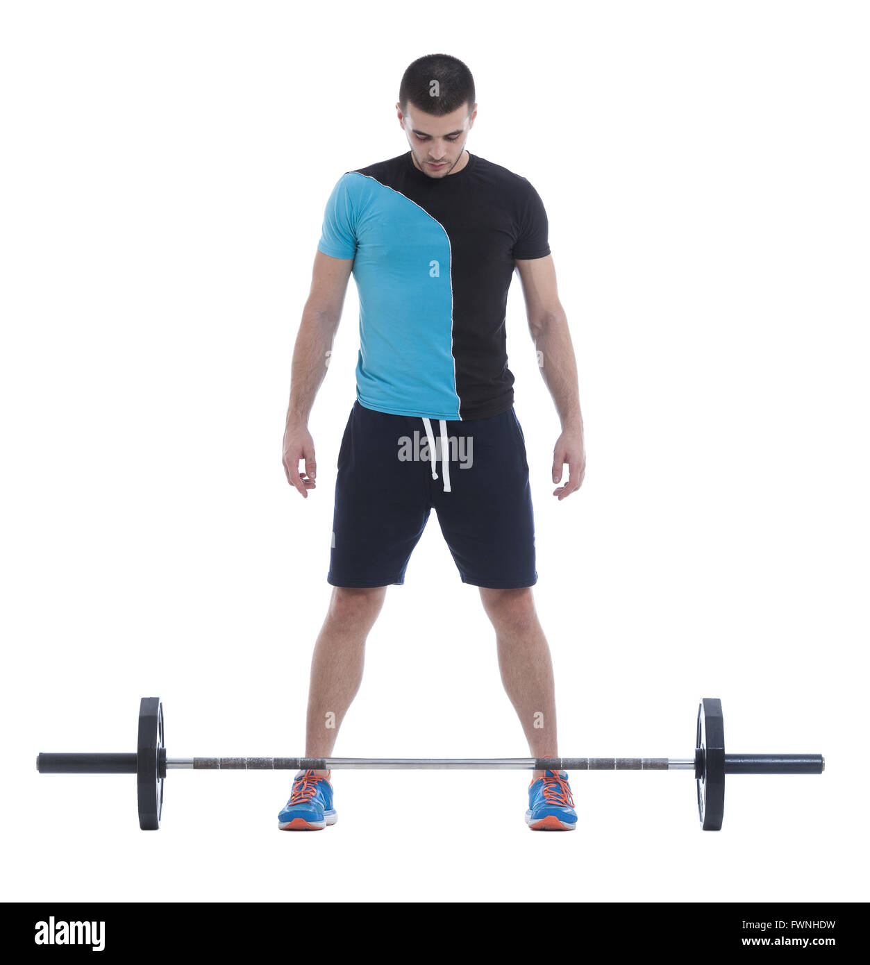 Athletic trainer getting ready for an exercise with olympic barbell ...