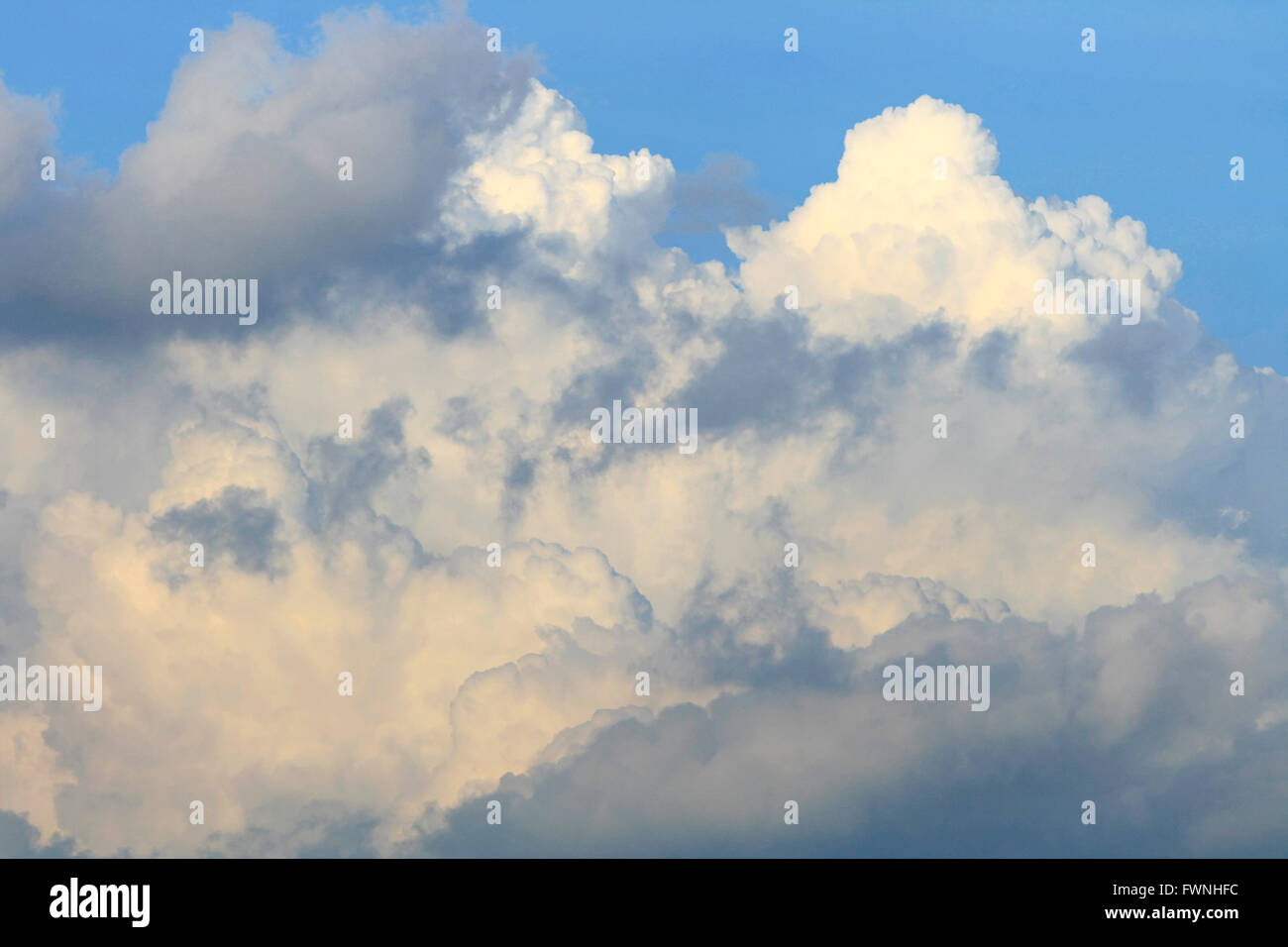 Cloudy Pattern with warm light in Sunset Time Stock Photo - Alamy