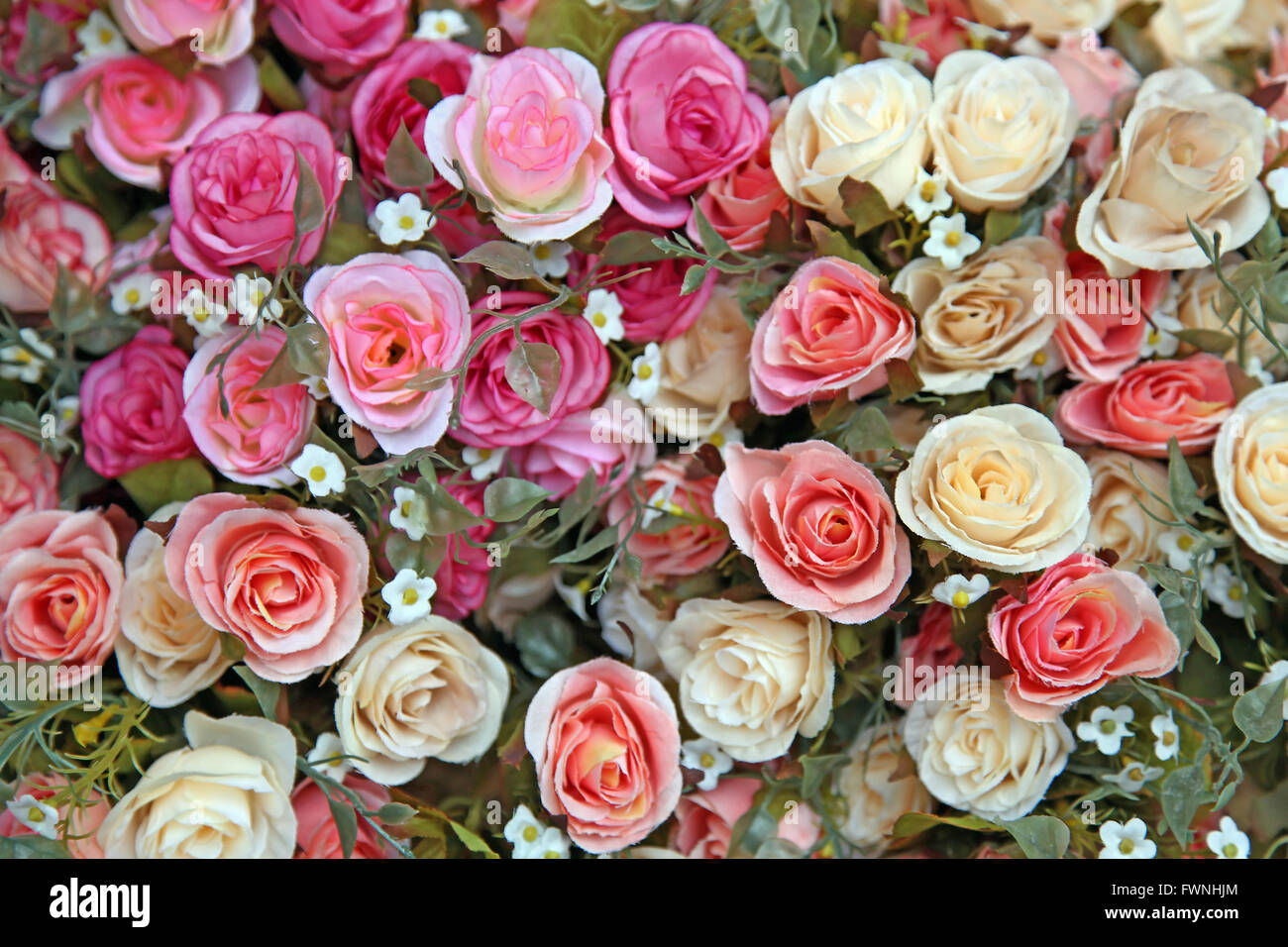 Heap of Fake rose flower using as love and beauty conceptual background ...