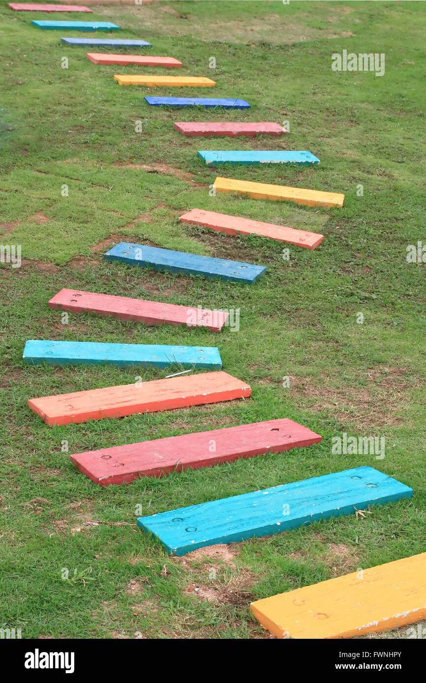 Colorful Wooden Walkway and Pathway in the Green garden grass fields ...