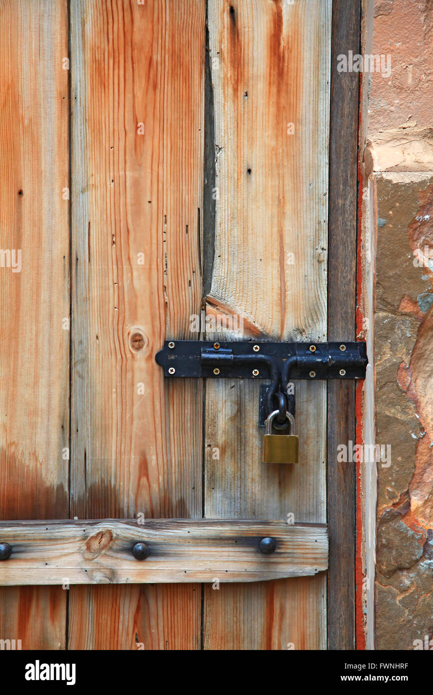 Old iron metal door handle locker on vintage italian style wooden door ...