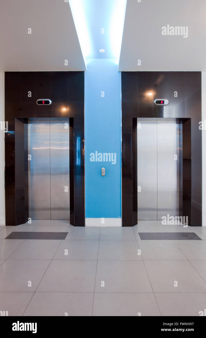 Front view of a modern elevator with closed doors in lobby Stock Photo ...