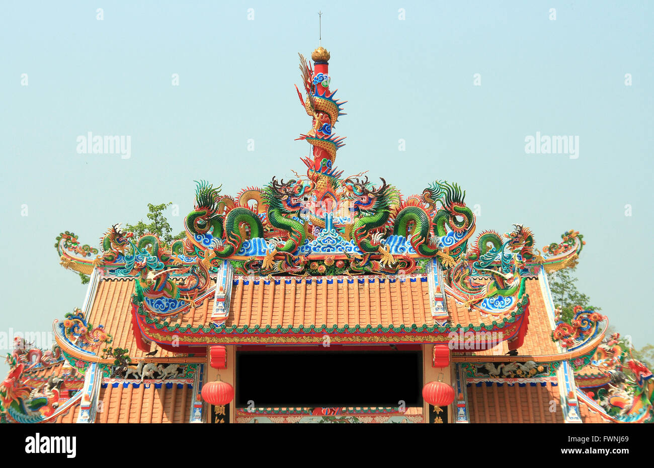 Dragon Statue on Top of Chinese Temple Shrine with blue sky Stock Photo ...