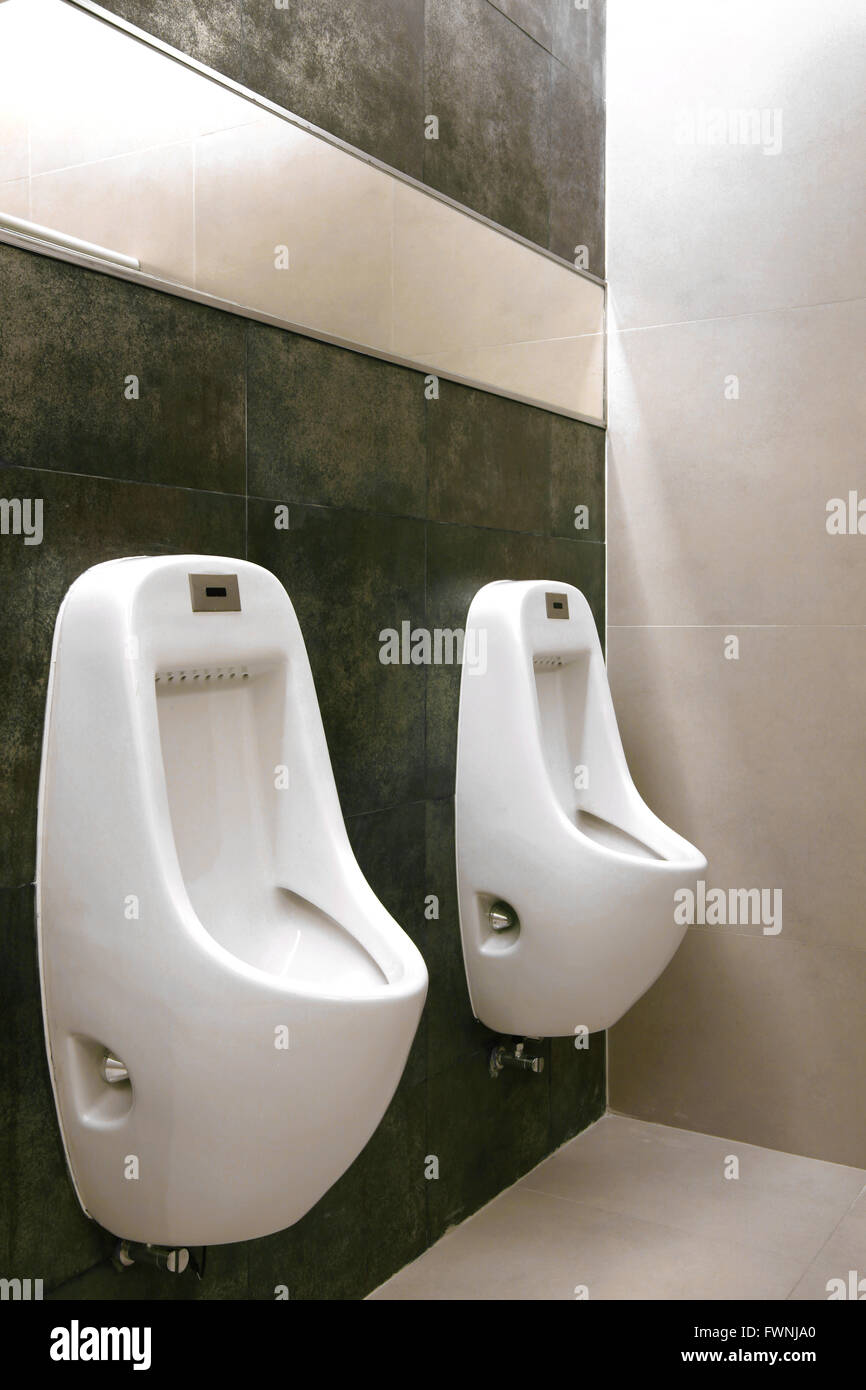 modern restroom interior photo with urinal row Stock Photo - Alamy