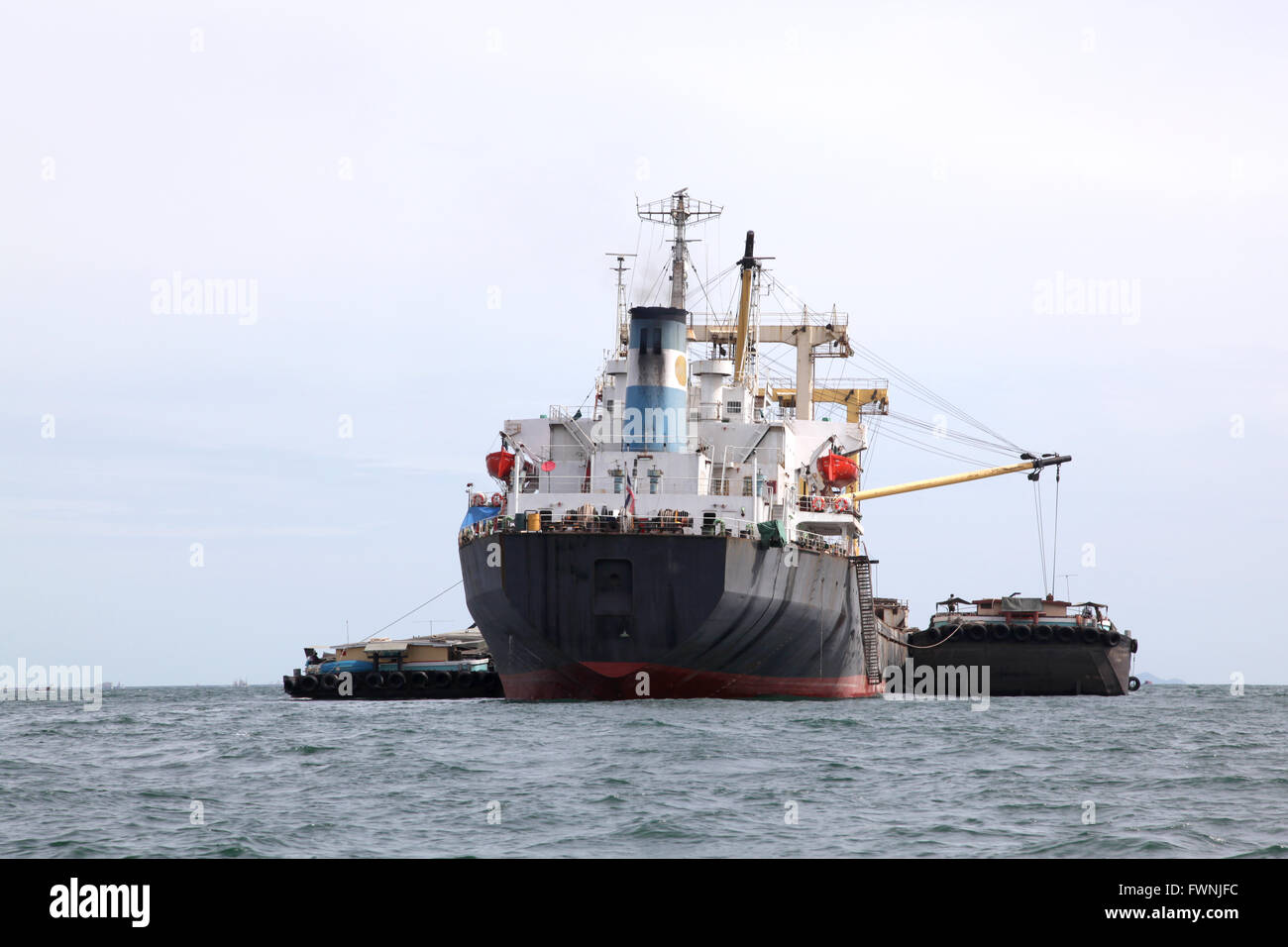 cargo liner freight Ship with containers and tug ship Stock Photo - Alamy