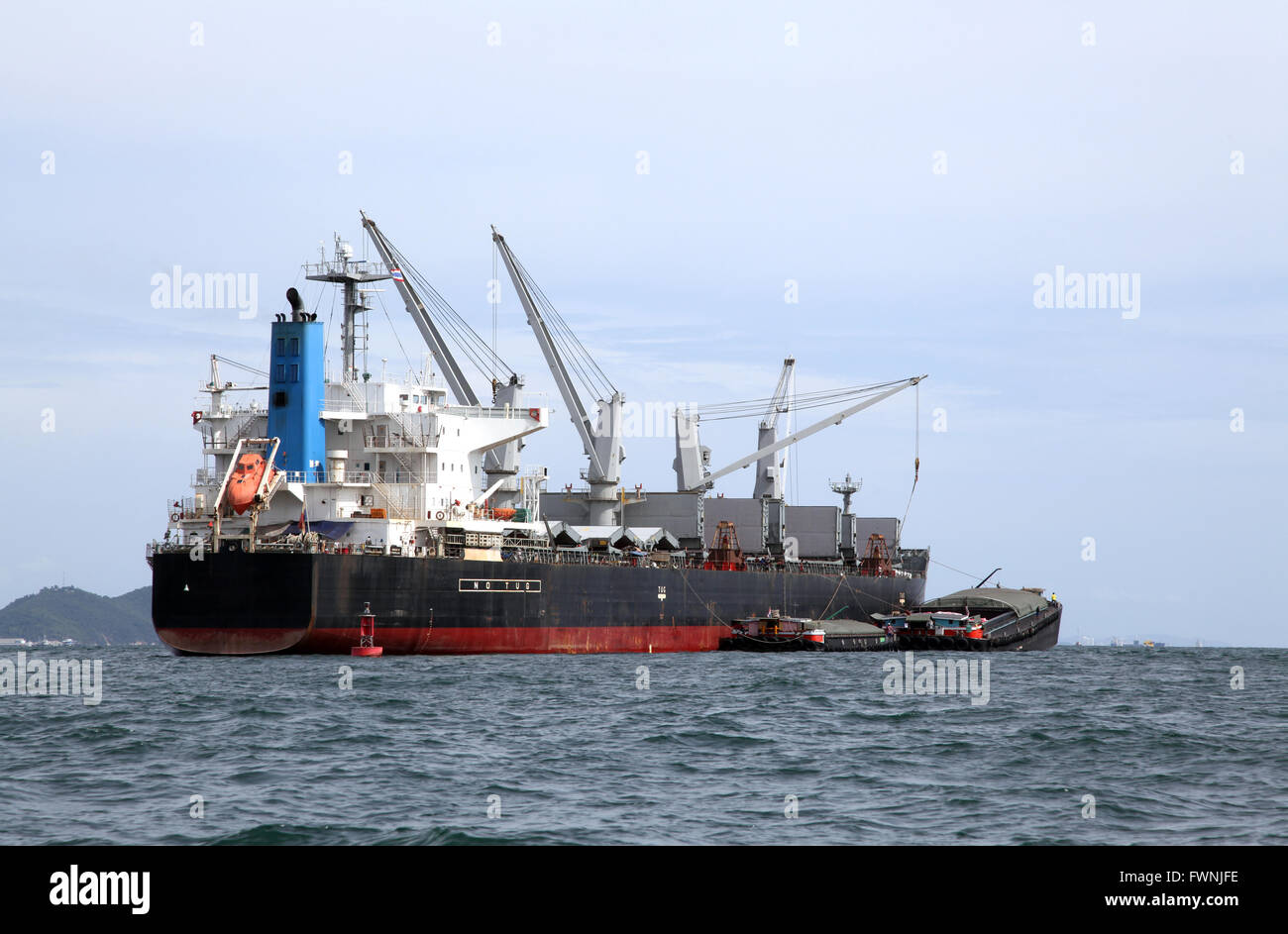 cargo liner freight Ship with containers and tug ship Stock Photo - Alamy