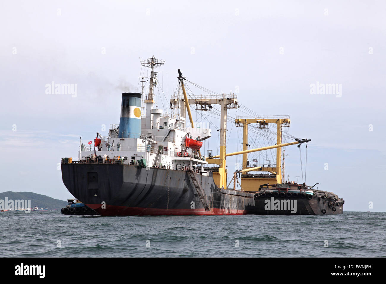 cargo liner freight Ship with containers and tug ship Stock Photo - Alamy