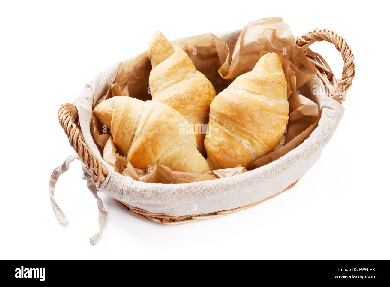 Fresh homemade croissants in basket. Isolated on white background Stock ...